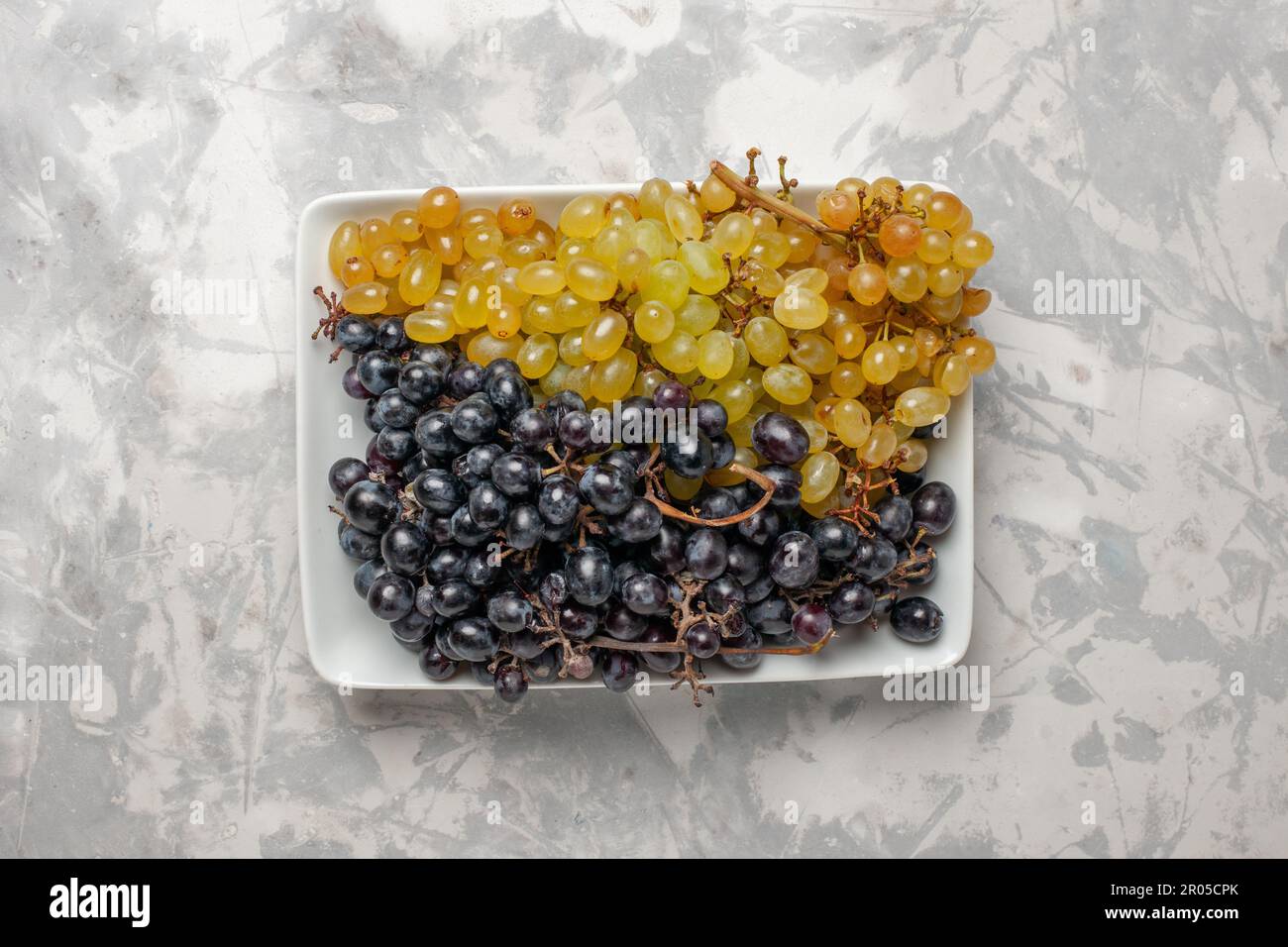 top view fresh juicy grapes inside plate on white background wine fresh ...