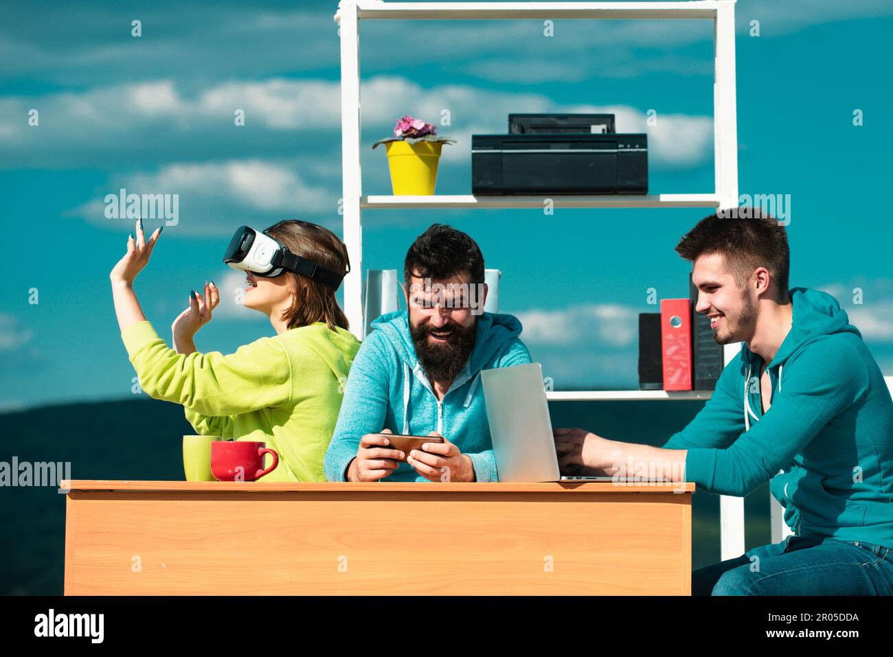 Team of young business people wearing vr headsets, working with new ...