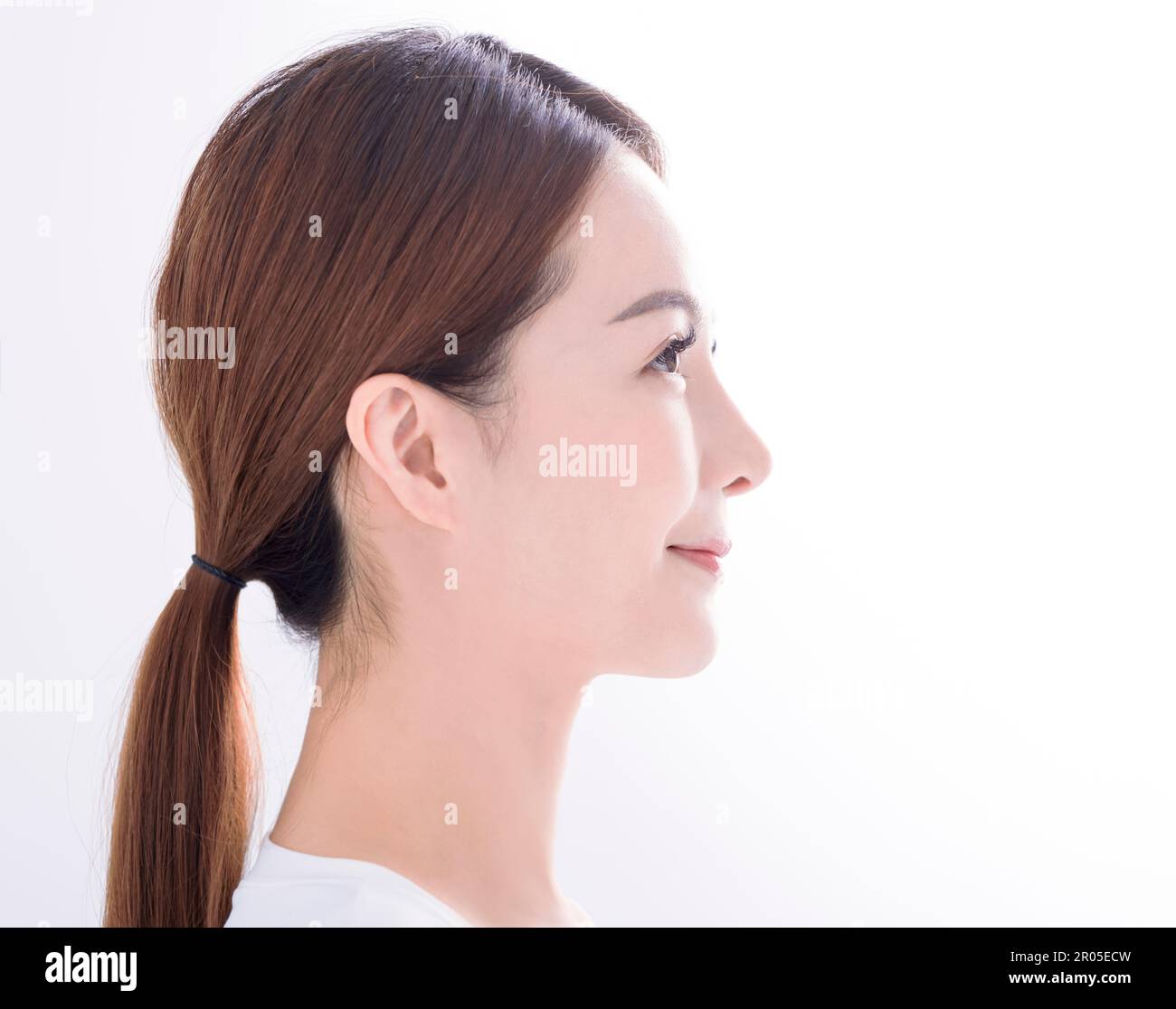 Side view of Beautiful young asian woman with clean fresh skin on white ...