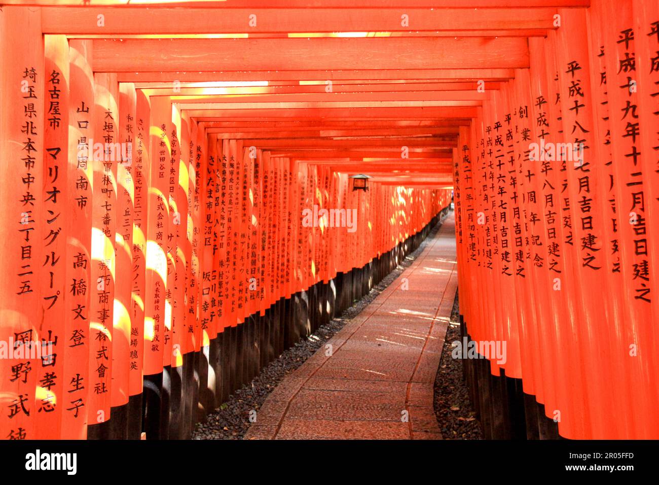 The iconic orange torii gates at Fushimi Inari Shrine in Kyoto create ...