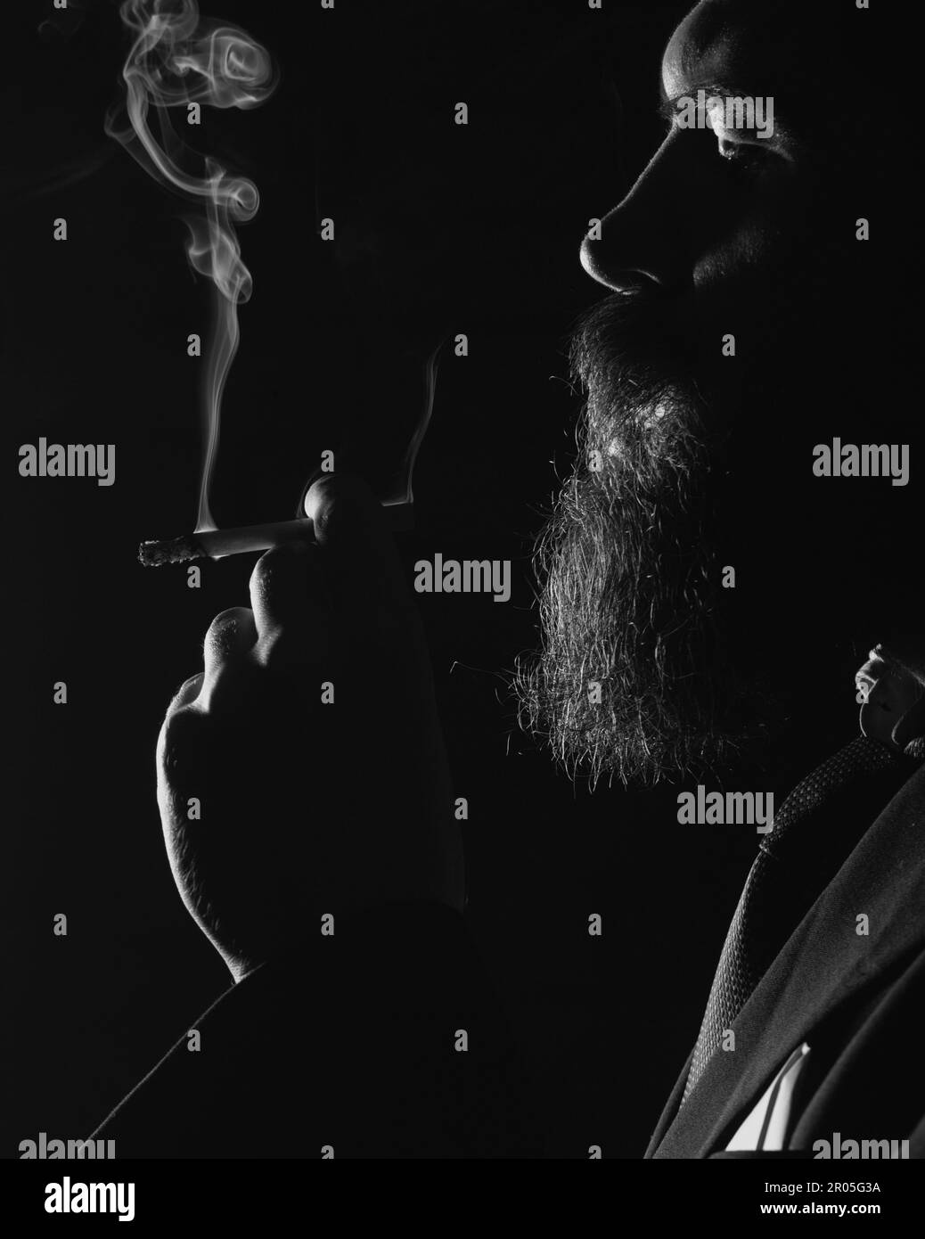 Man smoking cigarette. Smoke on black background. Cigarette smoke on ...