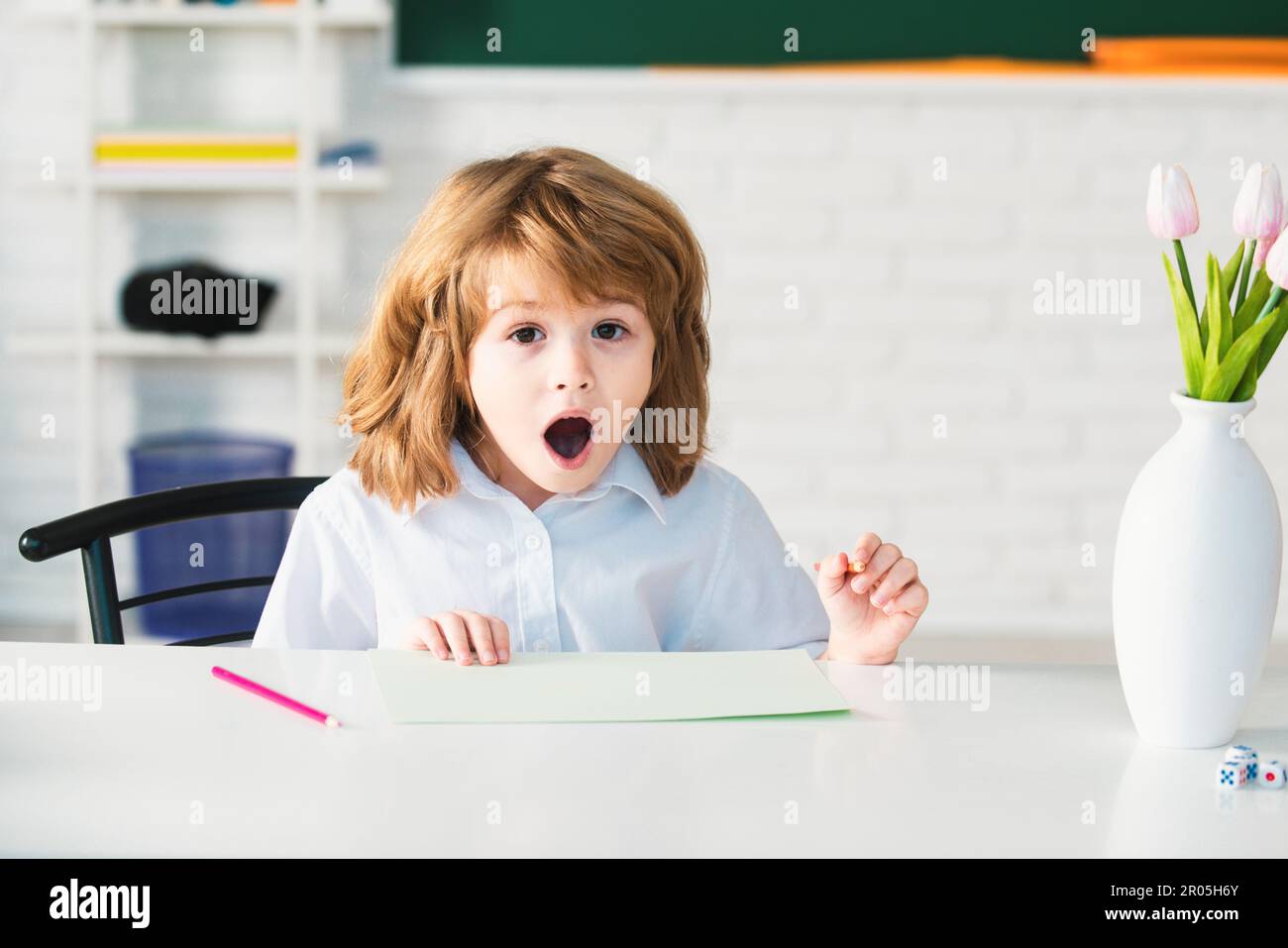 Excited kids in classroom at school. Education and learning for child ...