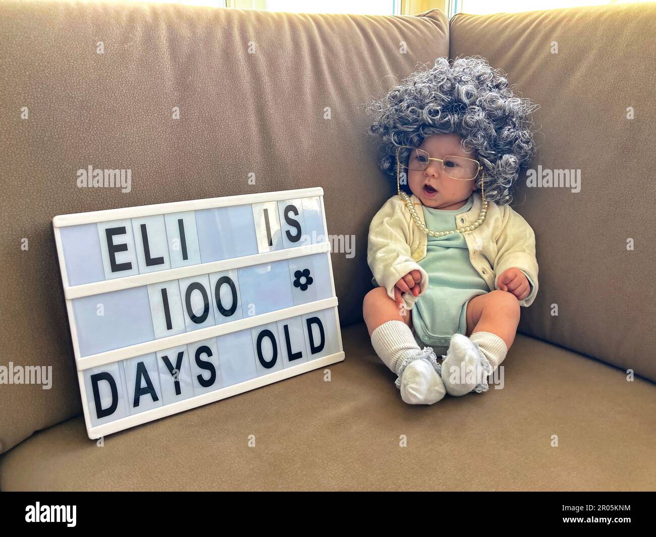 Cute little girl with wig disguised as old woman Stock Photo - Alamy