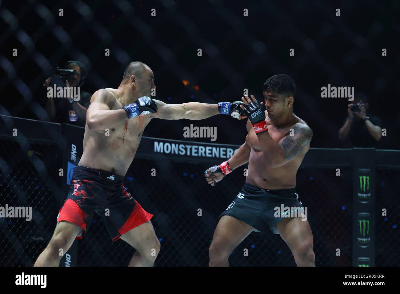 DENVER, COLORADO - MAY 5: (L-R) Fan Rong lands a jab on Aung La N Sang ...