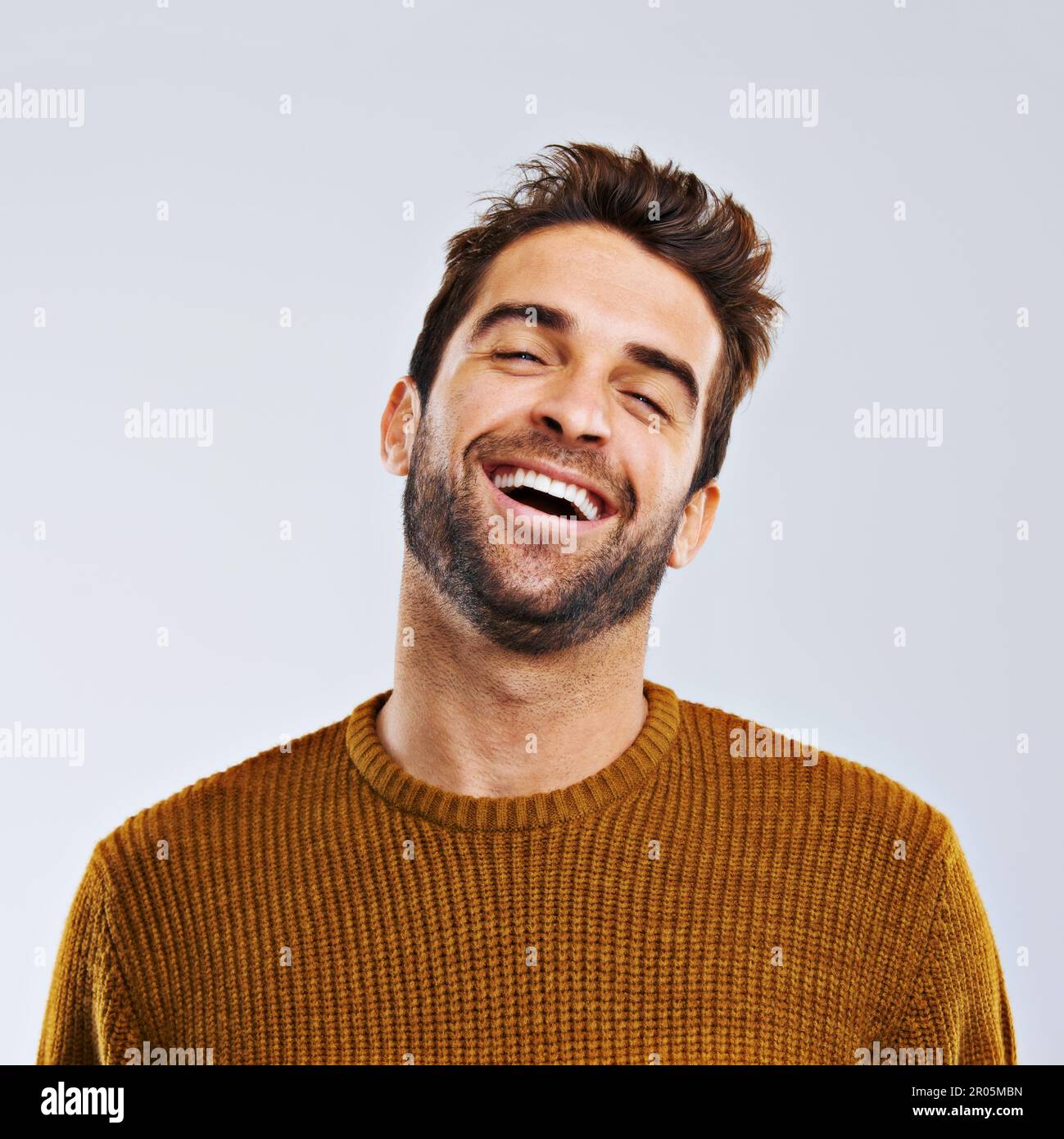 Laughing, comedy and portrait of happy man by white background. Smile ...