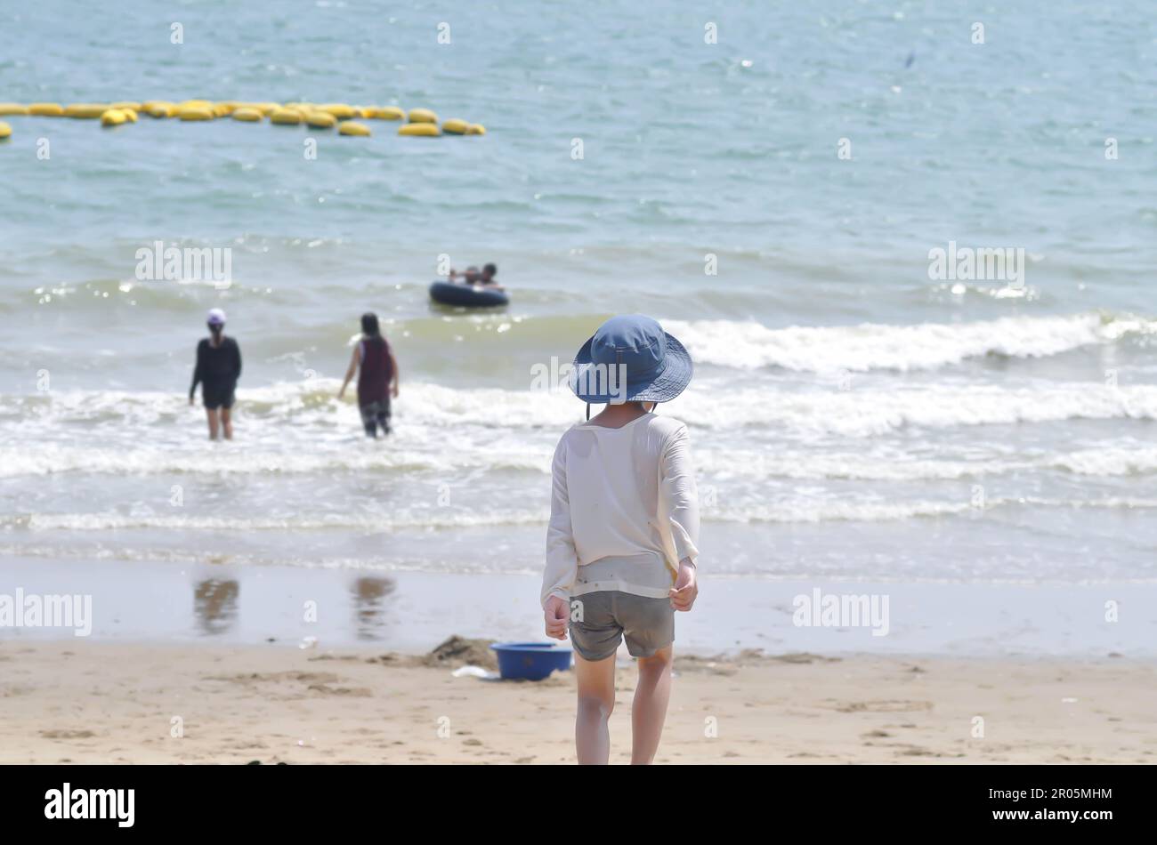 boy, sea and sun or sea background or a boy on the beach background ...