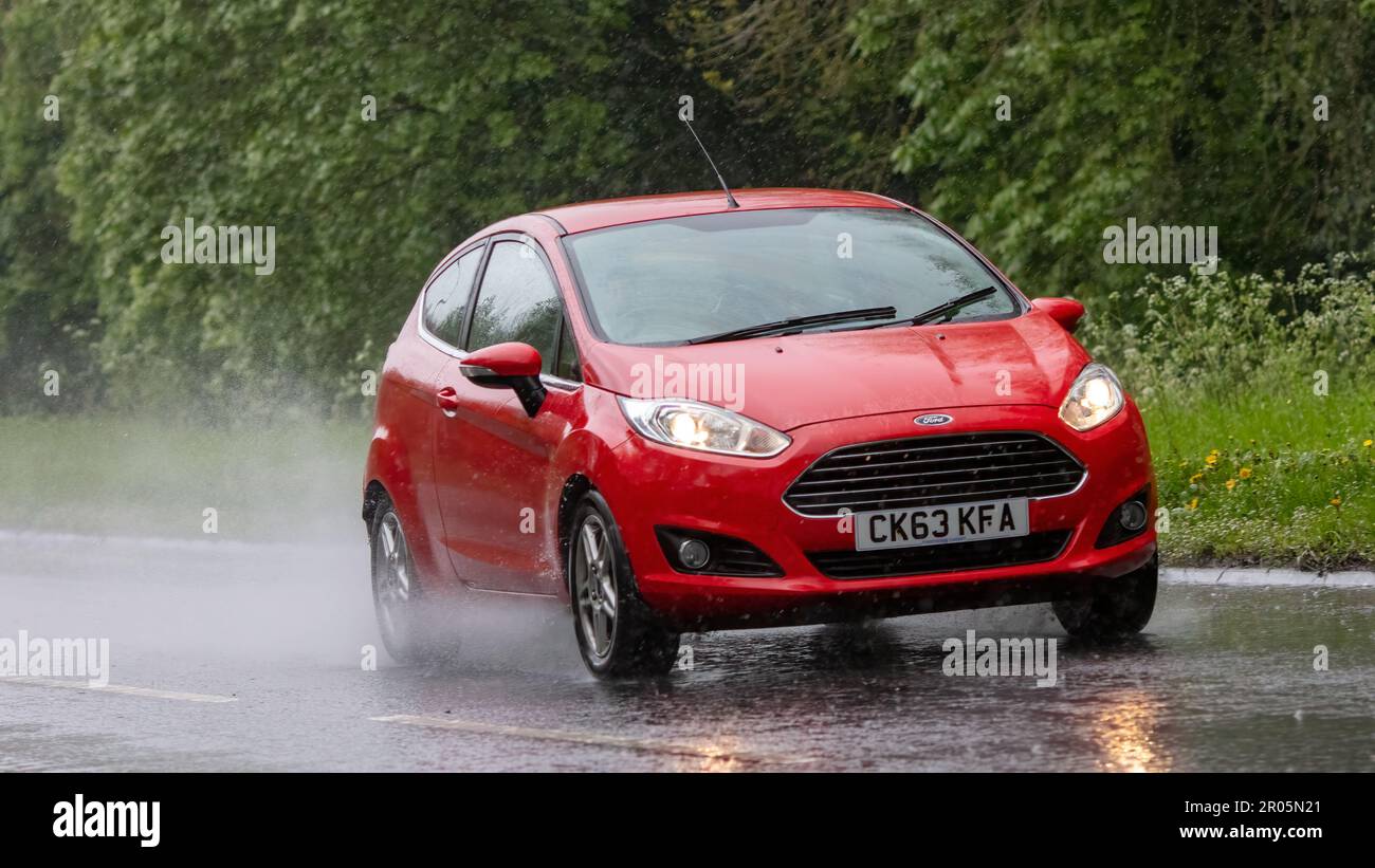 Stony Stratford,Bucks,UK - May 6th 2023. 2013 red FORD FIESTA driving ...