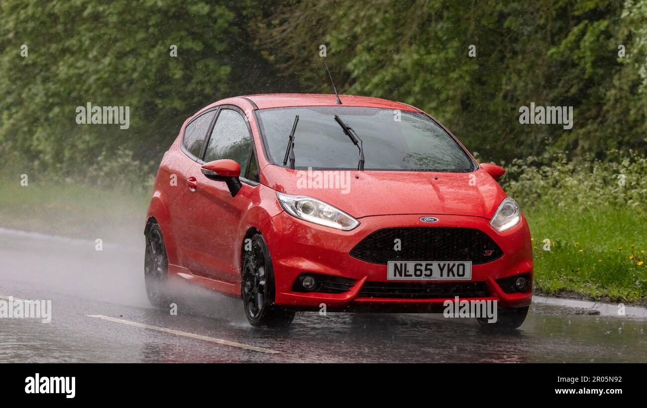 Stony Stratford,Bucks,UK - May 6th 2023. 2016 red FORD FIESTA driving ...