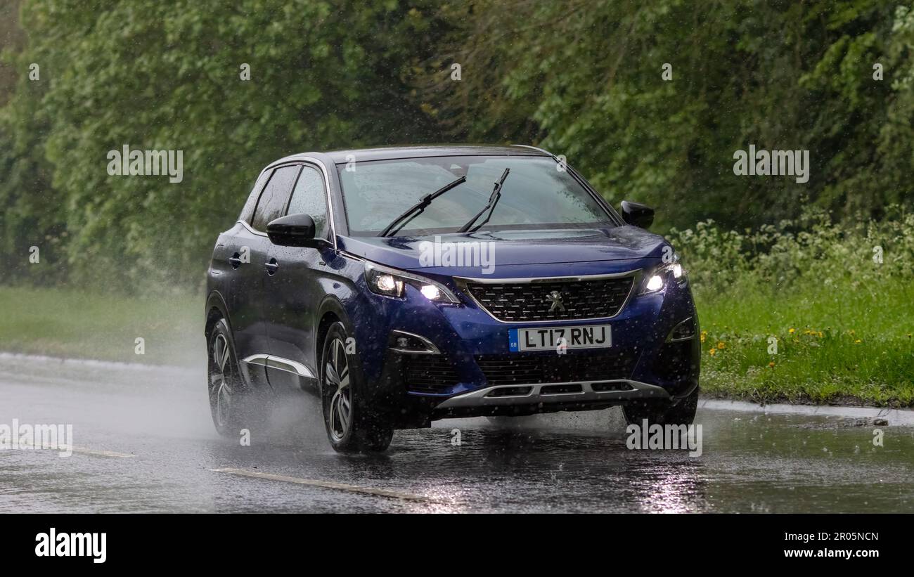 Stony Stratford,Bucks,UK - May 6th 2023. 2017 blue PEUGEOT 3008 driving ...