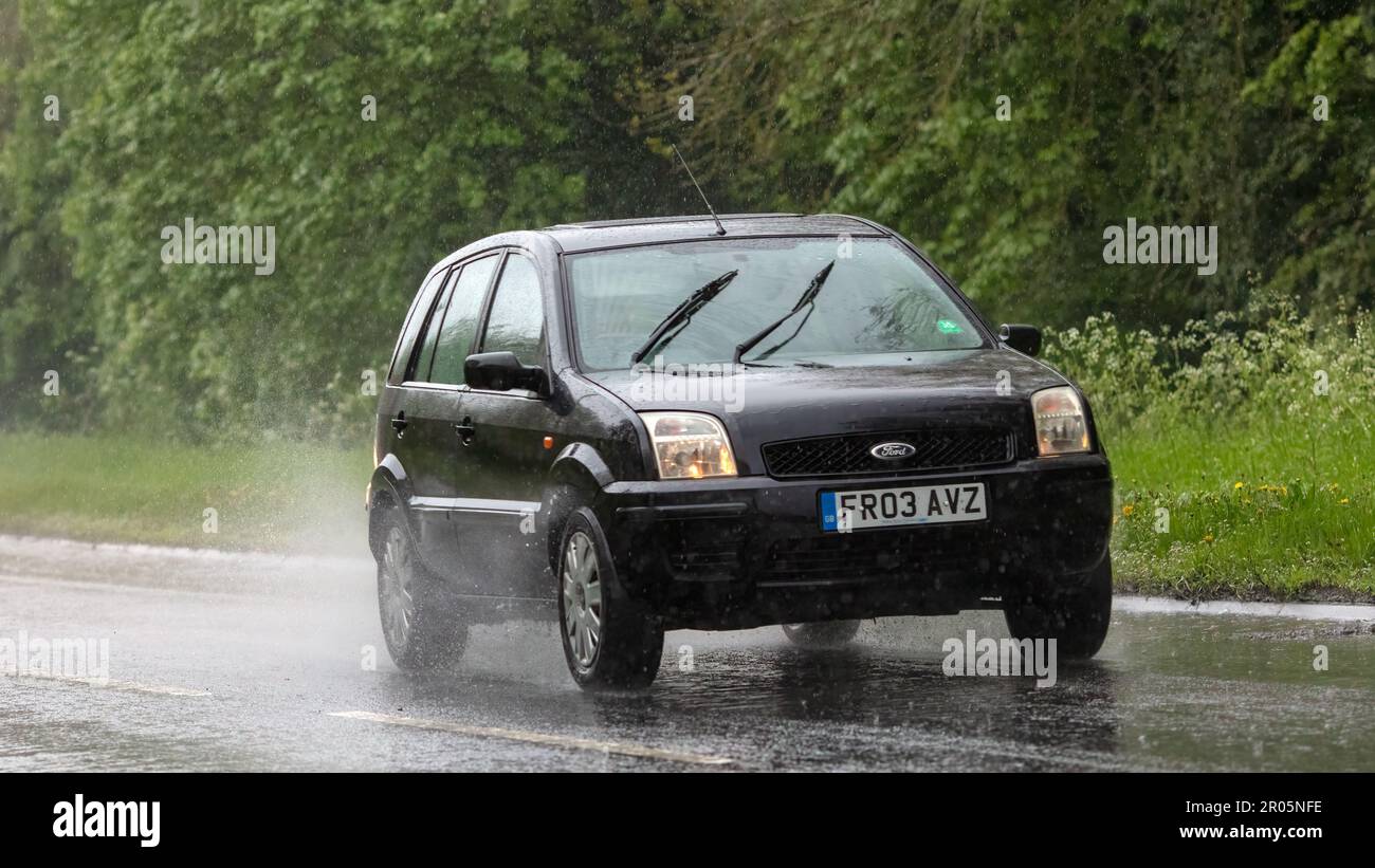 Stony Stratford,Bucks,UK - May 6th 2023. 2003 black FORD FUSION driving ...