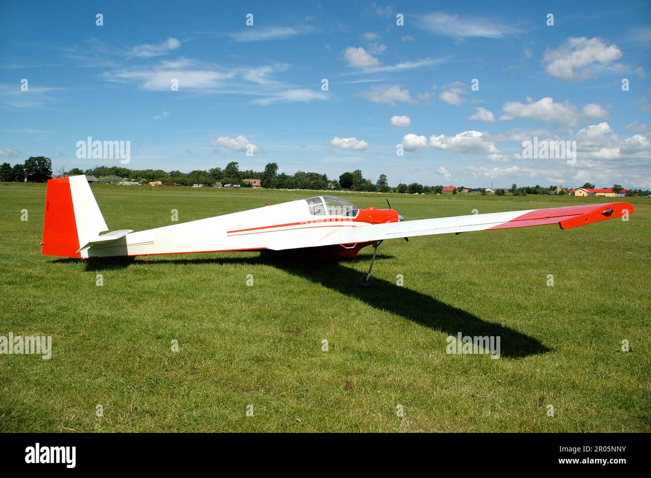 Olp plane on air field with blue and cloudy sky in the background Stock ...
