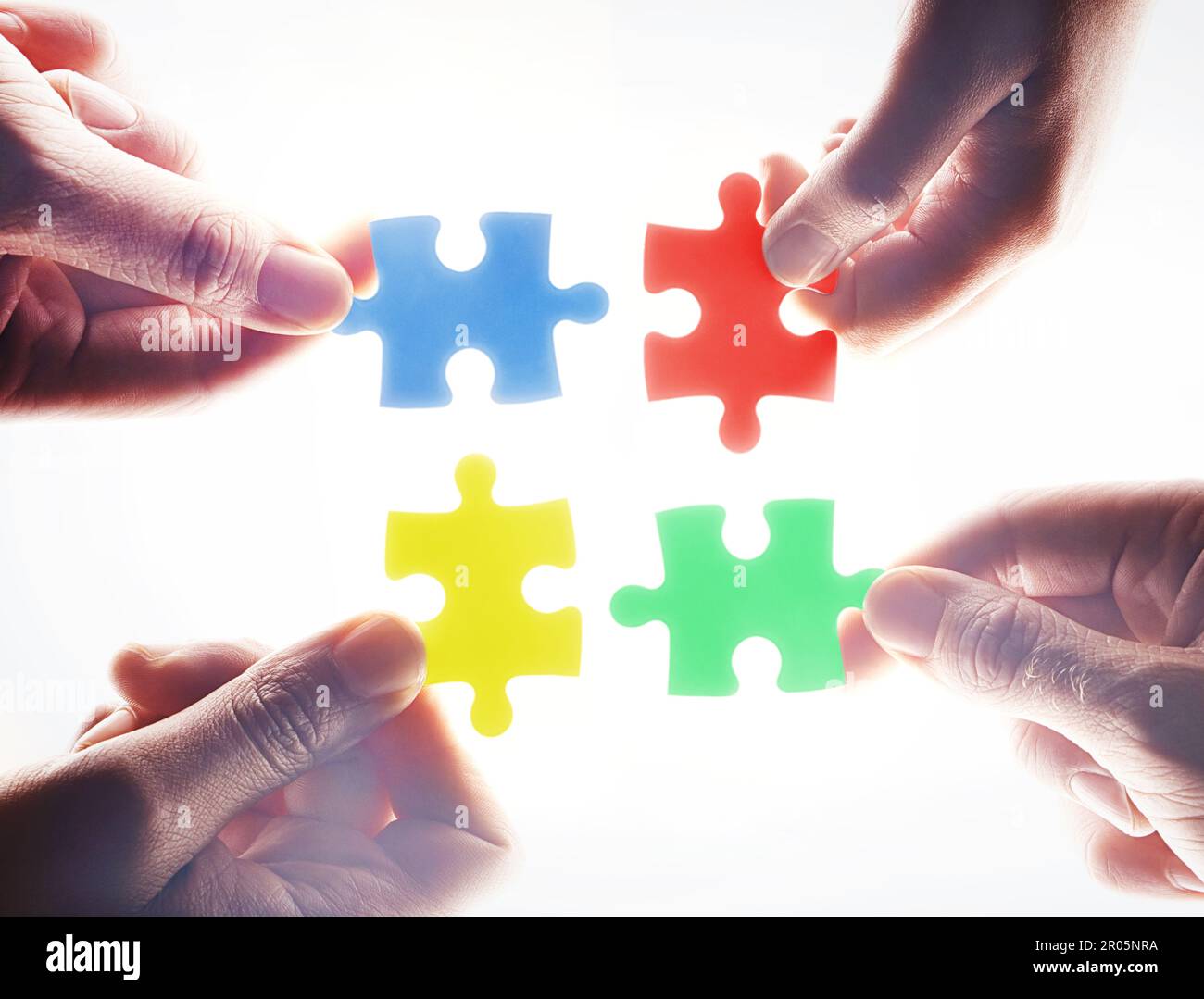 Hands, puzzle and teamwork in group, problem solving or together for ...