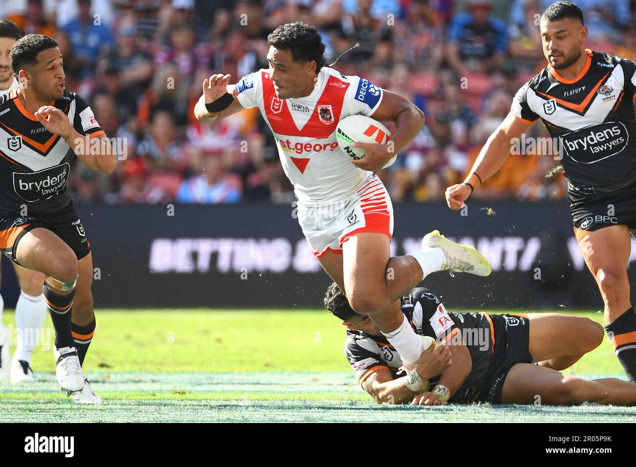 Max Feagai of the Dragons is tackled during the NRL Round 10 match ...