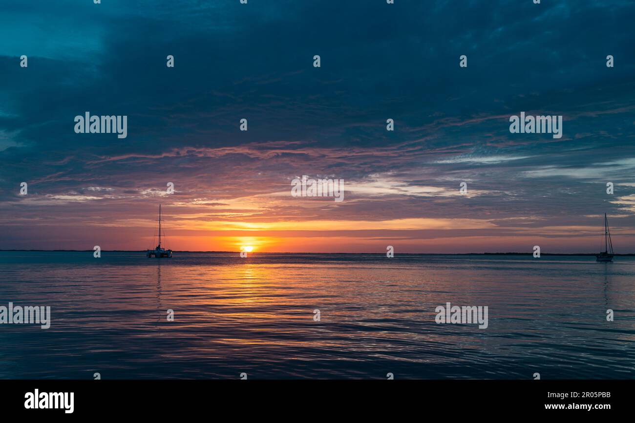 Boats on the sea at sunset. Sailboats with sails. Ocean yacht sailing ...