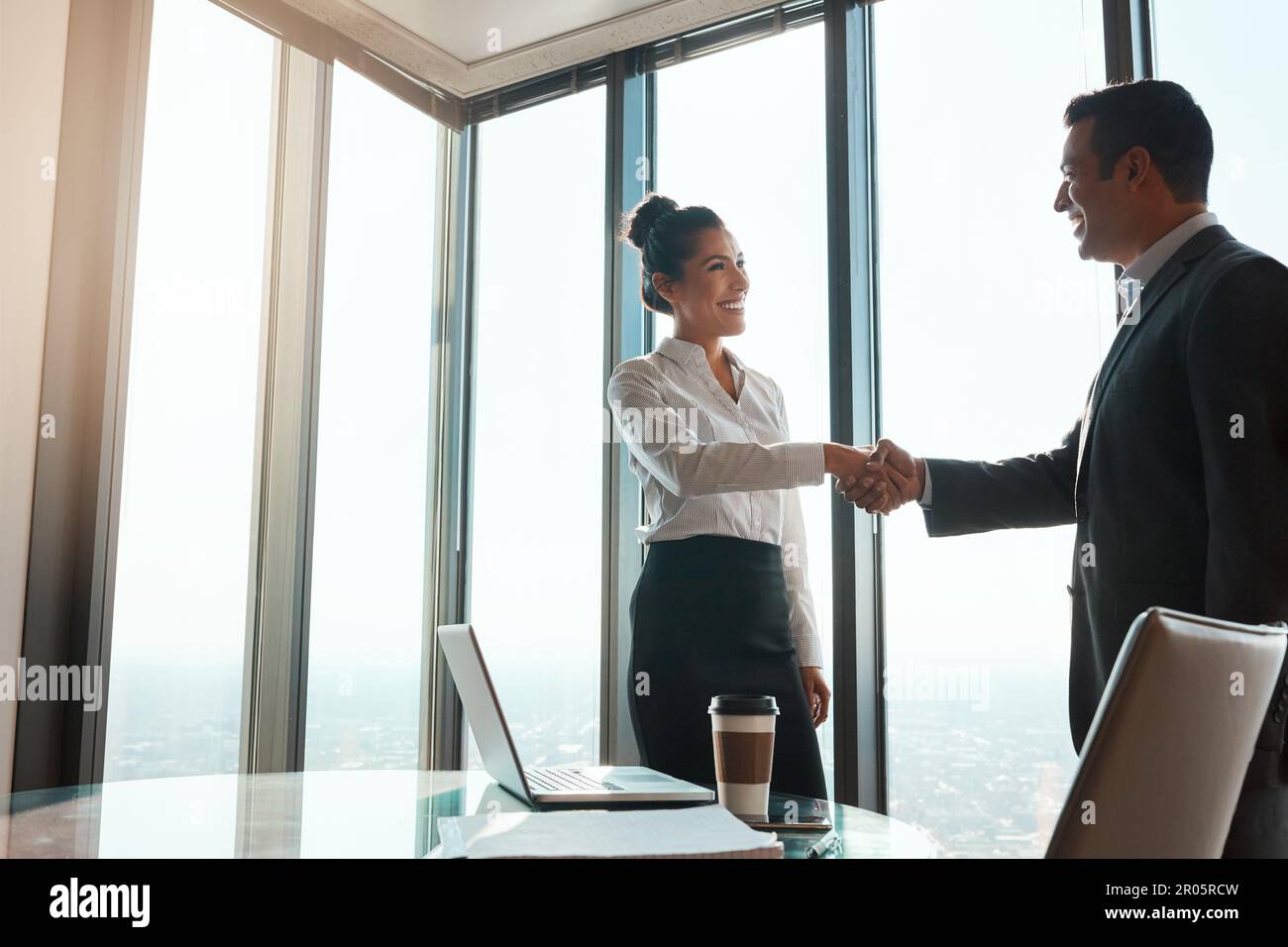 Merging to put bigger and better plans in motion. two businesspeople ...