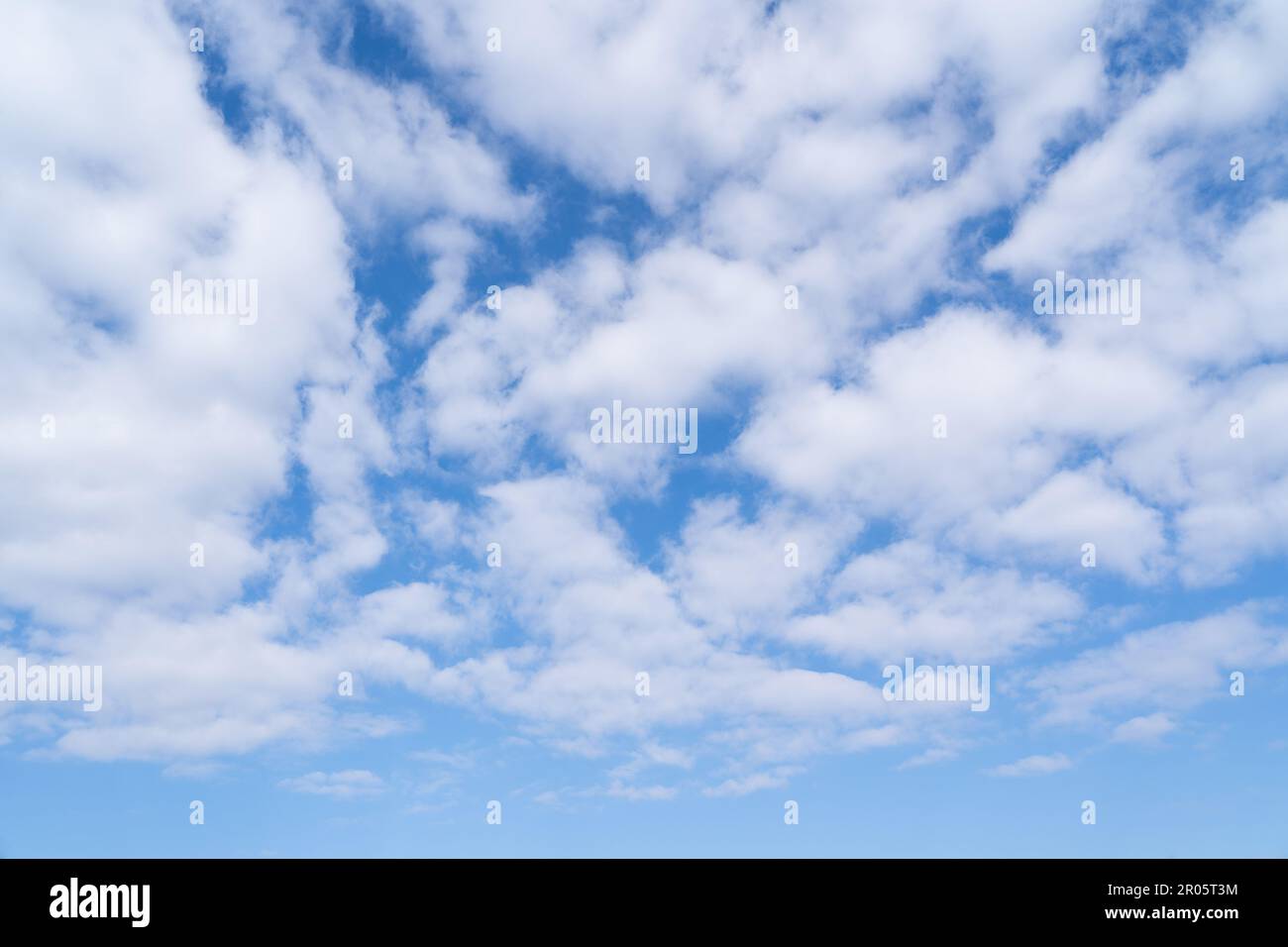 Blue sky with white clouds by daylight in spring Stock Photo - Alamy