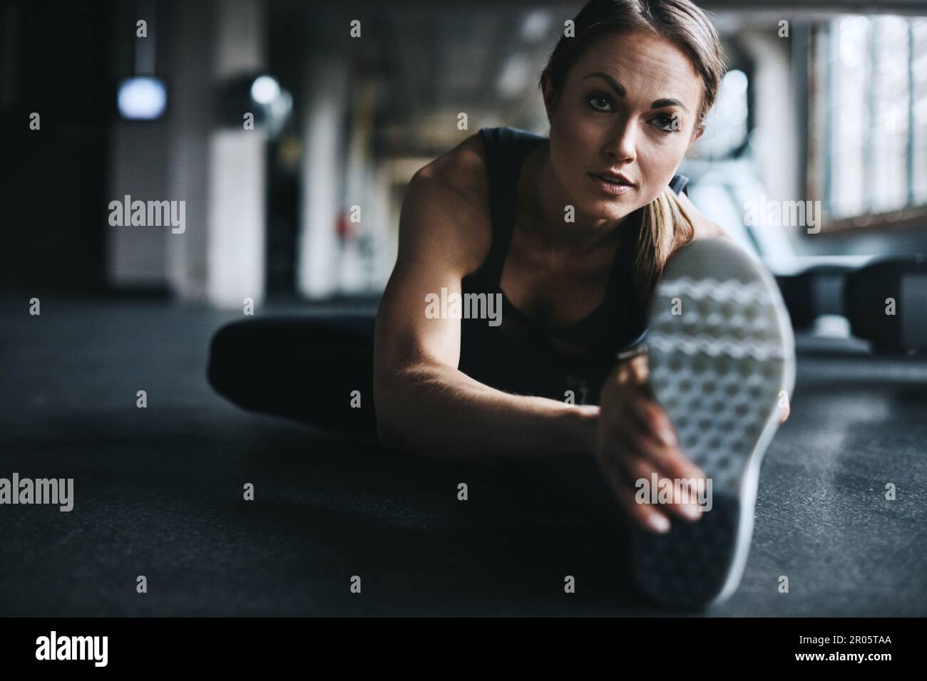 Nothing distracts her from reaching her fitness goals. an attractive ...