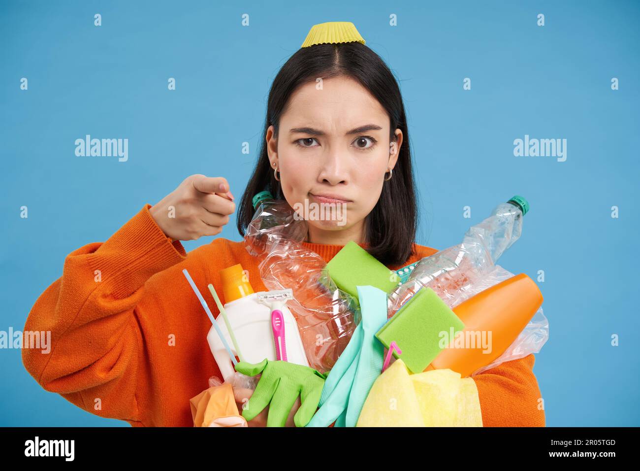 Serious korean woman pointing finger at camera, blame people for ...