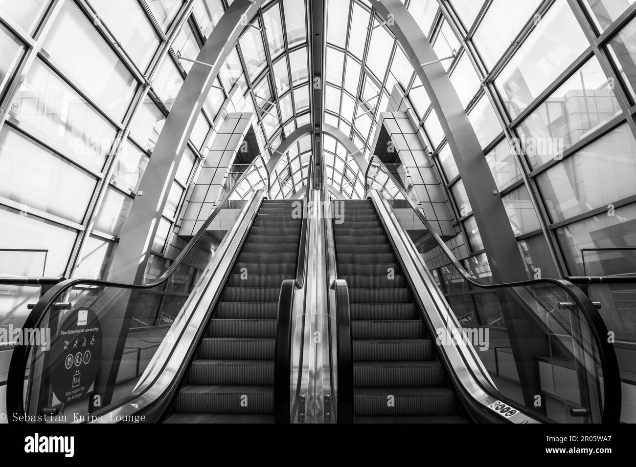 High-resolution black and white shot of escalators traveling in a ...