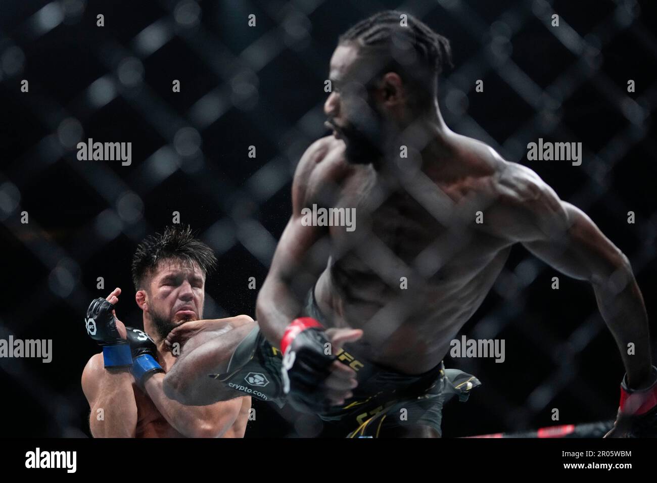 Aljamain Sterling, of Jamaica, kicks Henry Cejudo during the fifth ...