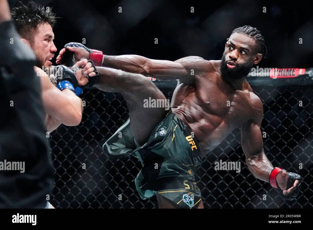 Aljamain Sterling, of Jamaica, kicks Henry Cejudo during the fifth ...