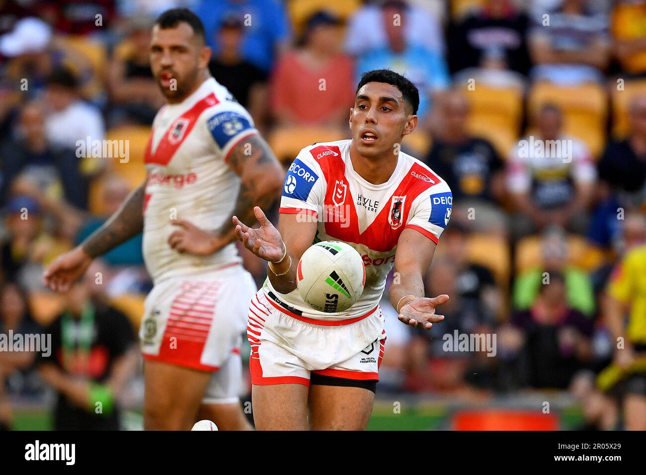 Tyrell Sloan of the Dragons passes the ball during the NRL Round 10 ...