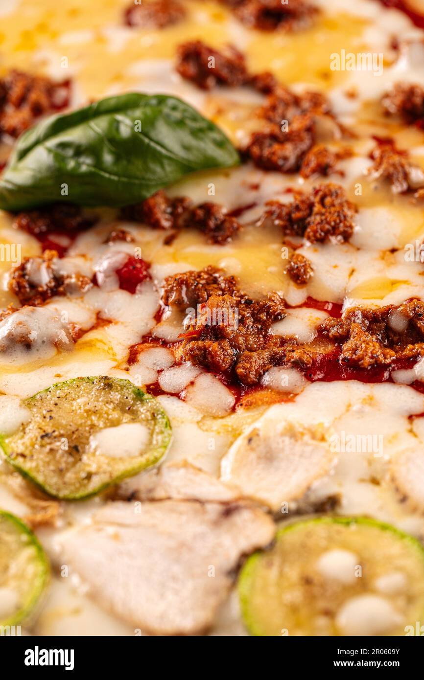 Big assorted pizza with variety of toppings Stock Photo - Alamy