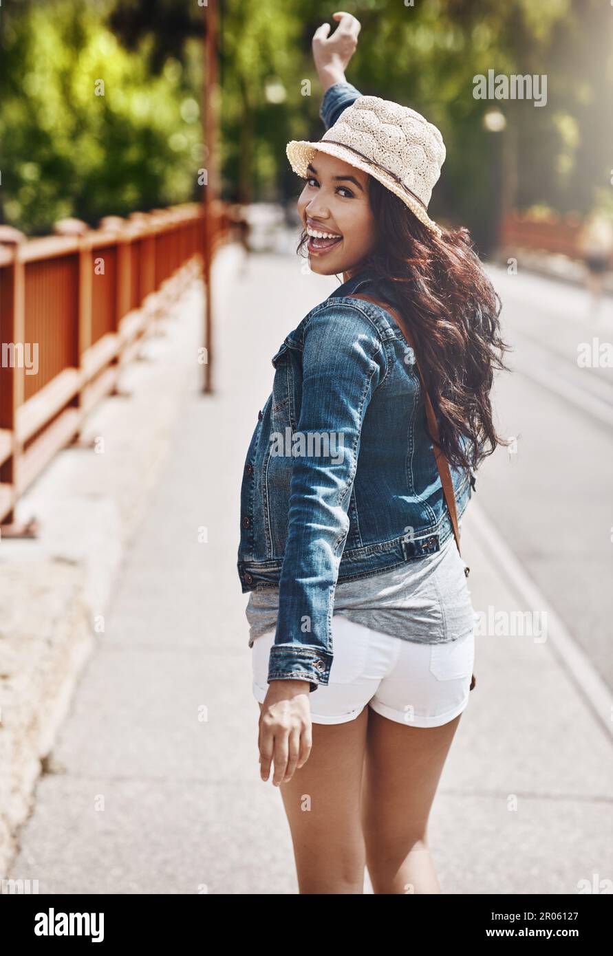 Exploring new places is a thrill. a beautiful young woman looking over ...