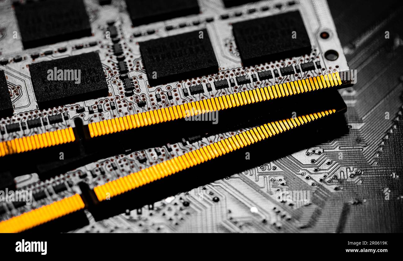 Macro Close up of computer RAM chip and motherboard on dark background ...