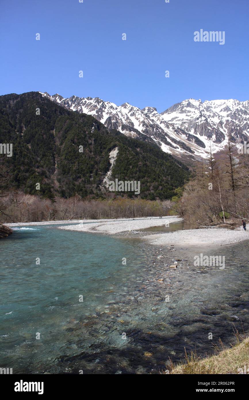 The clear Azusa River and snow-capped Mount Hotaka viewed from Kappa ...