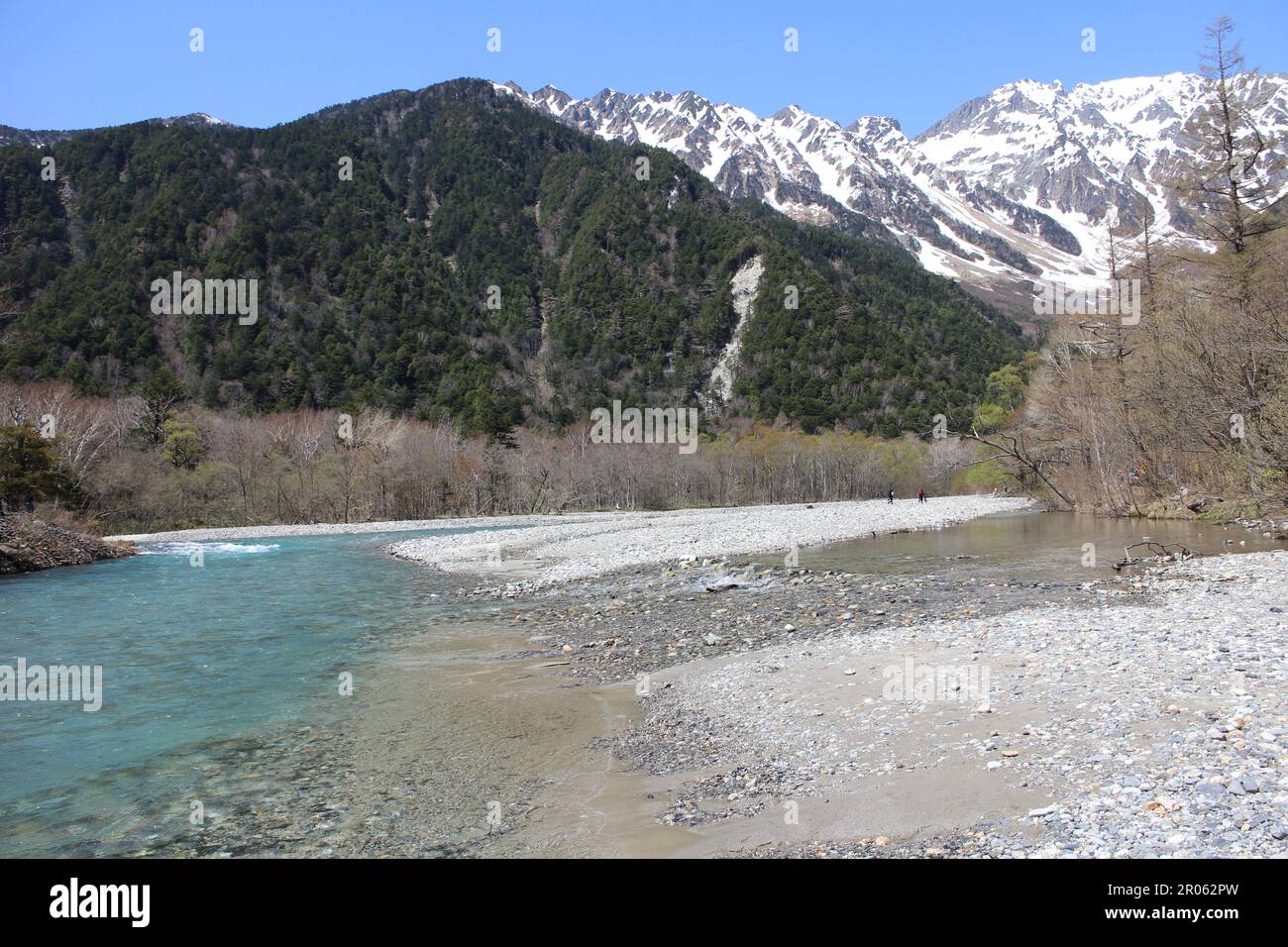 The clear Azusa River and snow-capped Mount Hotaka viewed from ...