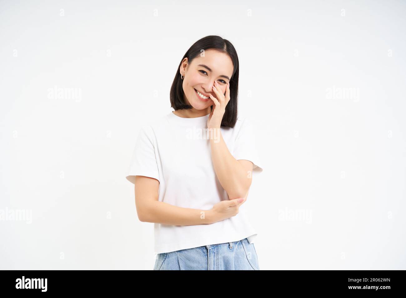 Portrait of tender, cute young asian woman, looking with flirty, silly ...