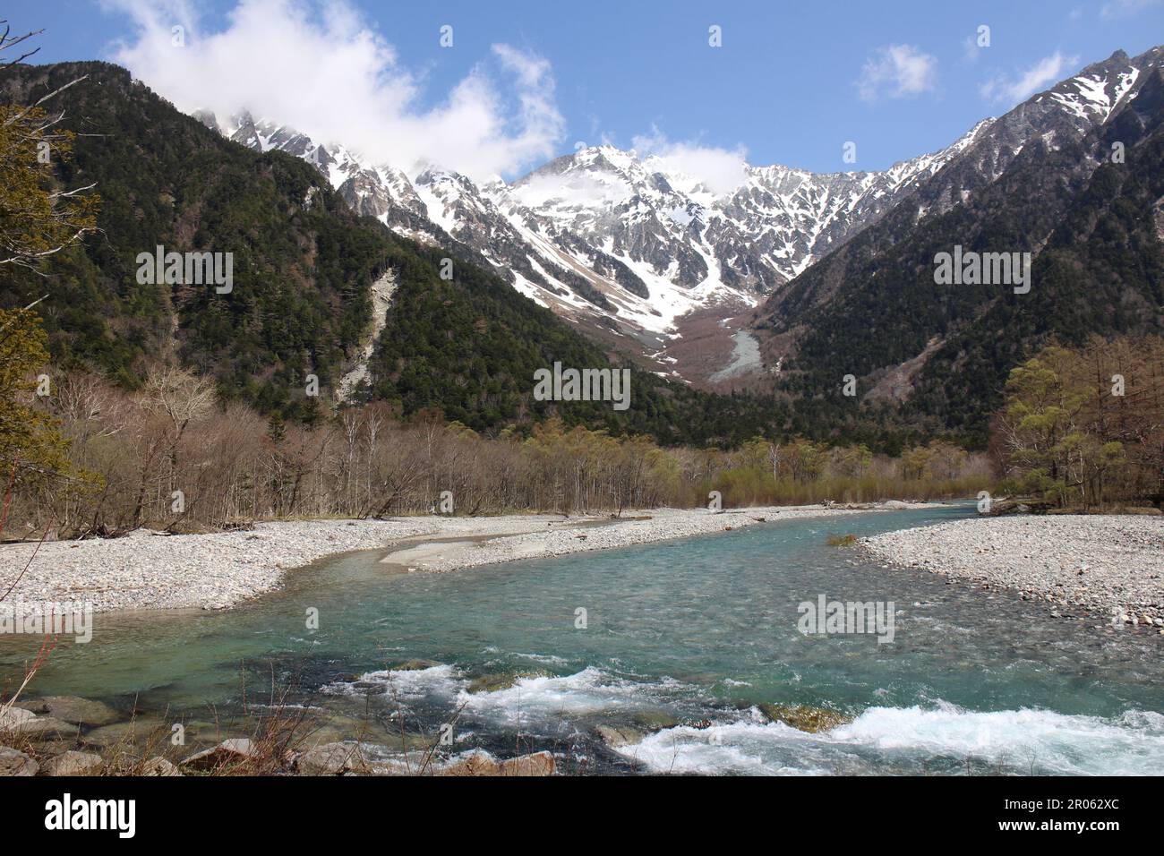 The clear Azusa River and snow-capped Mount Hotaka viewed from ...