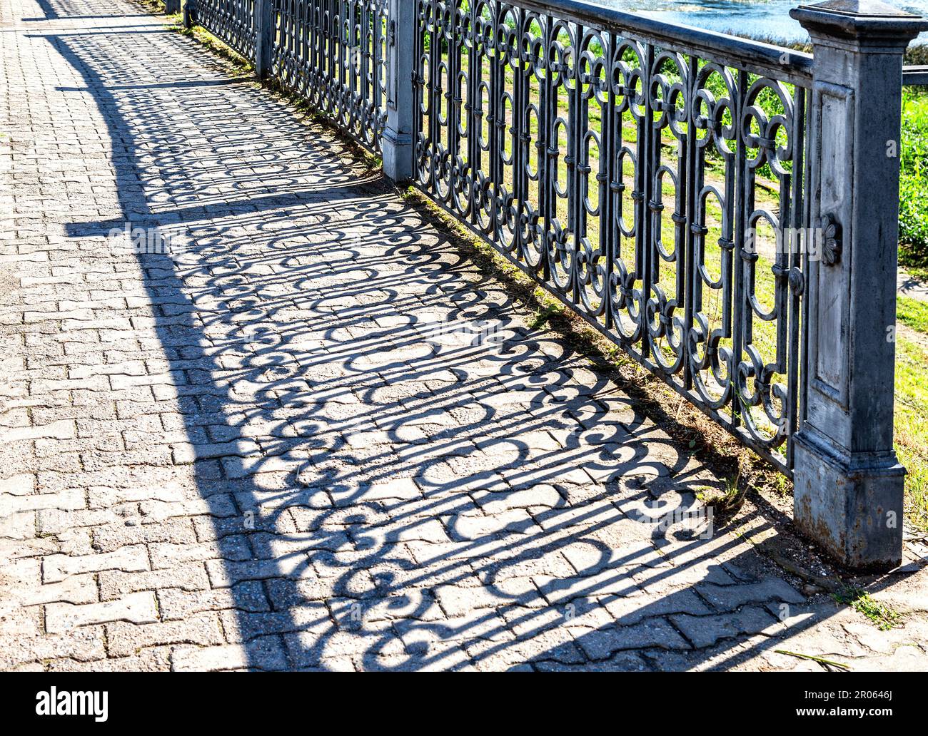 Shadow from the city decorative grating on the pavement in Torzhok city ...