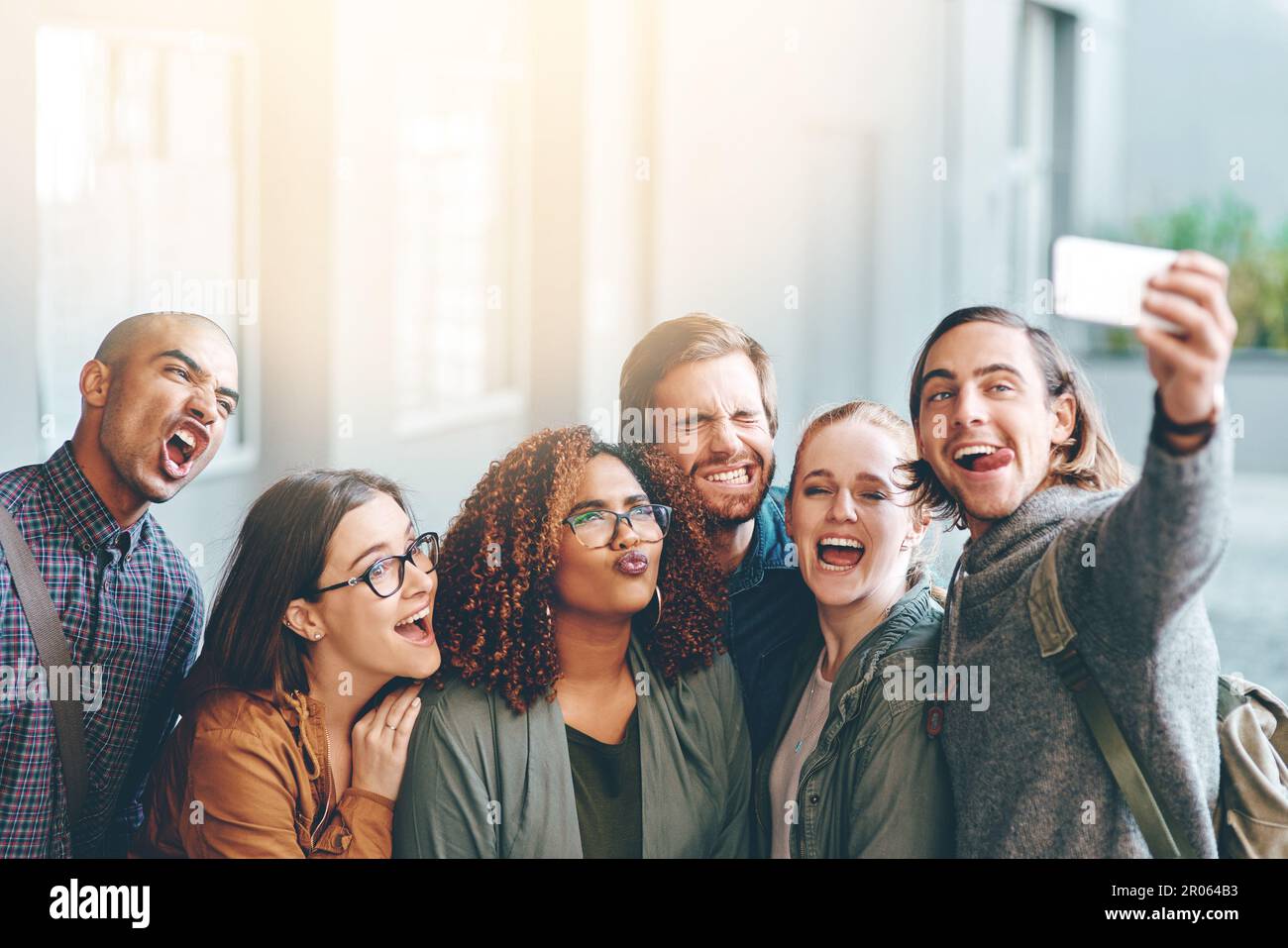 Student squad. Portrait of a group of happy young students taking a ...