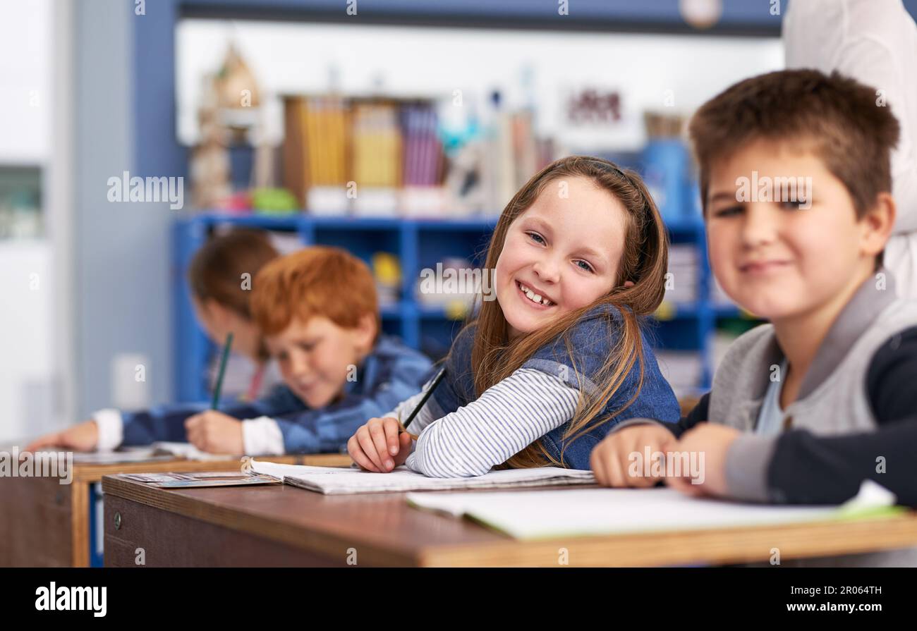 Eager to be in class. elementary school children in class Stock Photo ...