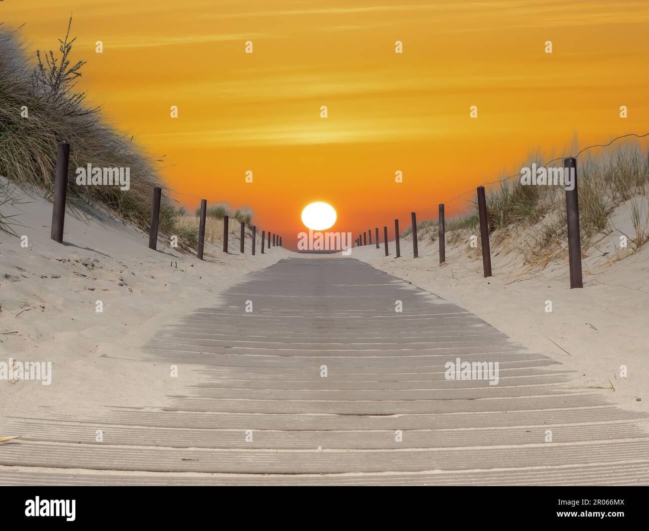 Beach path with sunrise on the Baltic Sea Stock Photo - Alamy