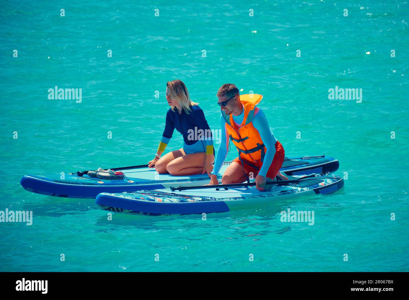 Silhouette woman standing on paddleboard hi-res stock photography and ...