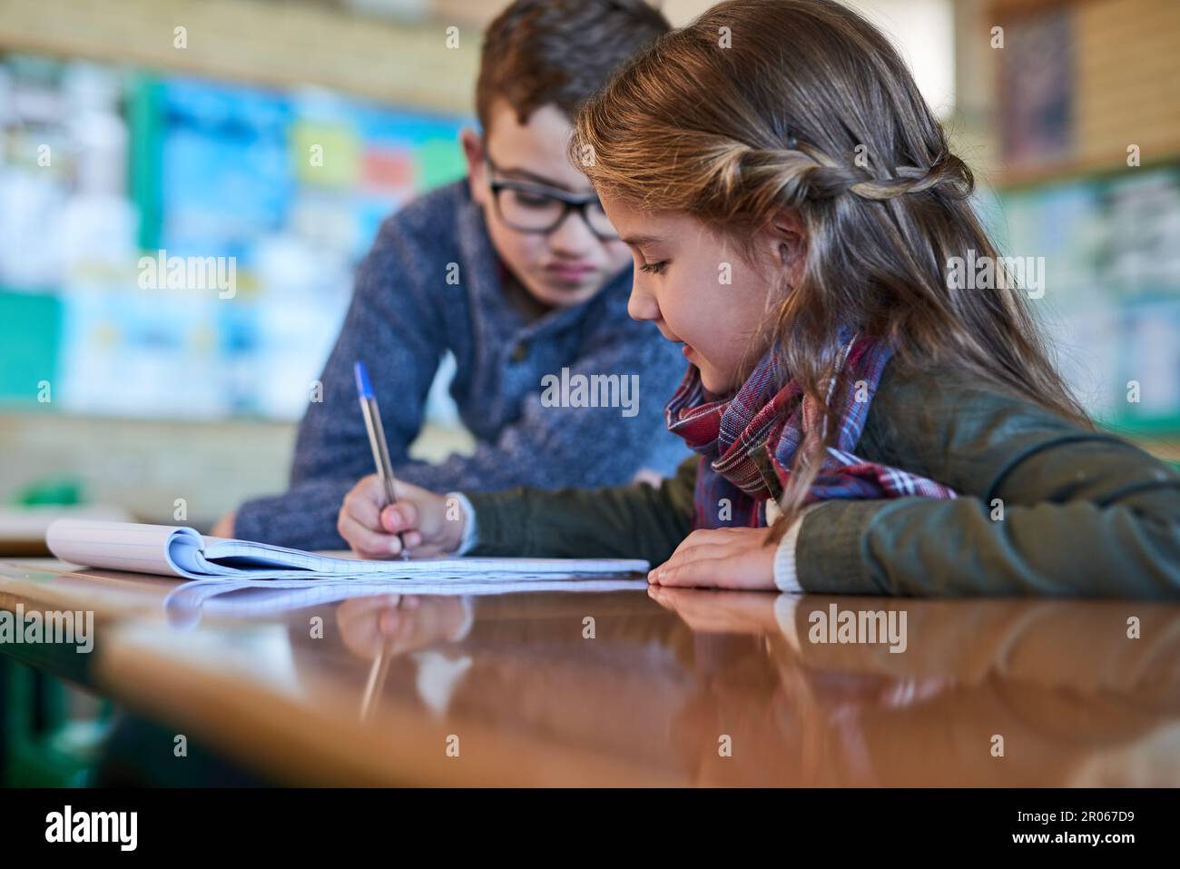 Working in pairs to complete their worksheet. two elementary school ...