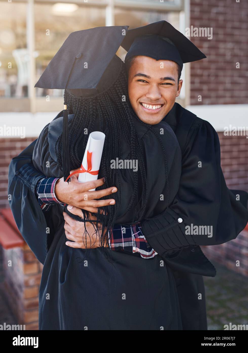 Things end but memories last forever. two happy young students hugging ...