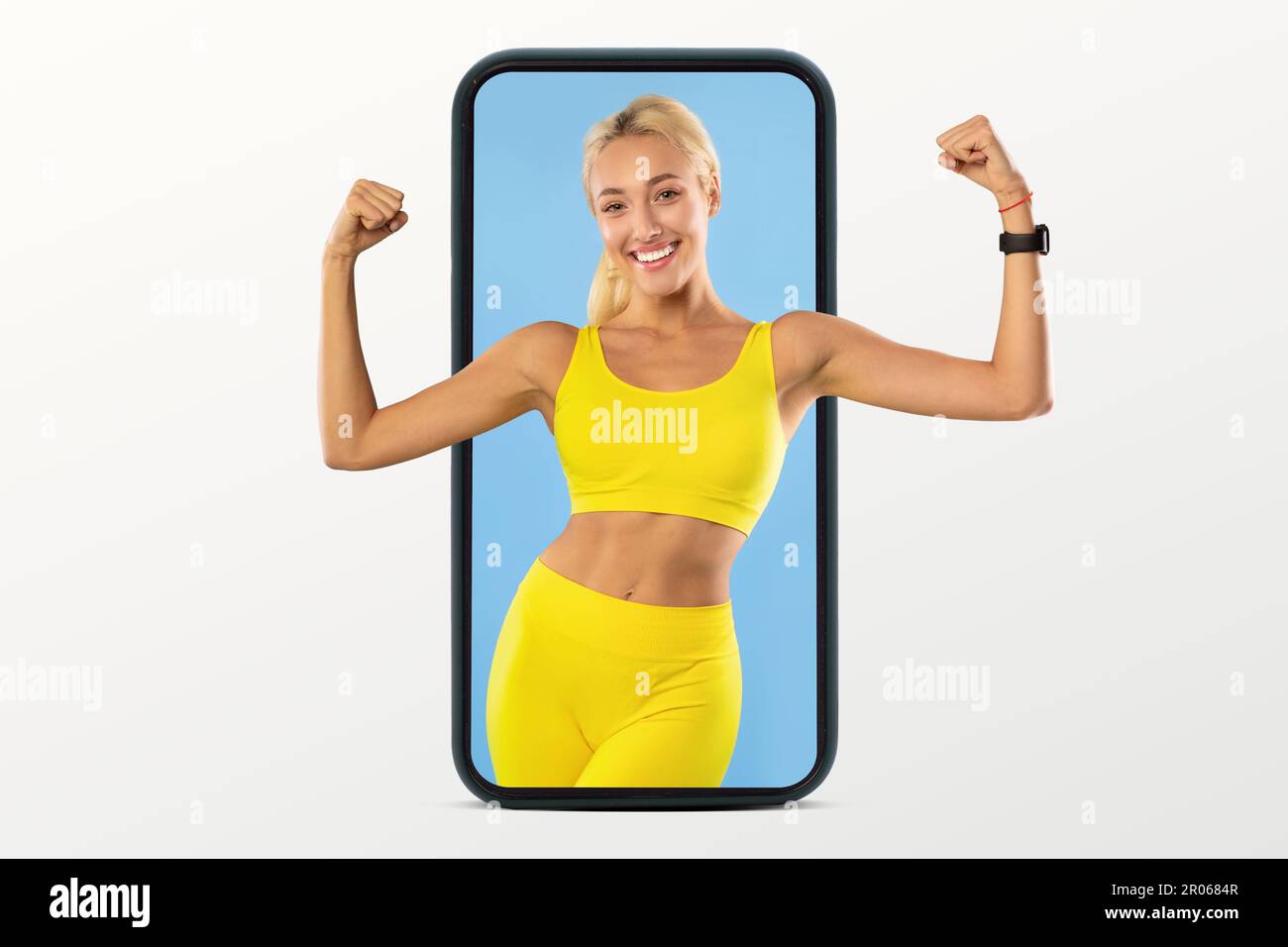 Glad millennial european slim lady in sportswear shows muscles, enjoy ...