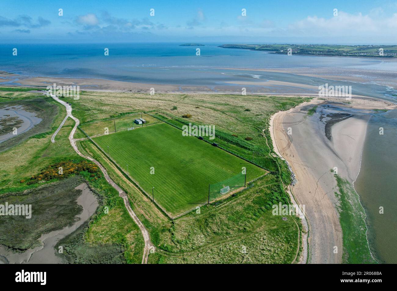Aerial view of Pilmore Strand and the St Itas GAA pitch near Youghal in ...