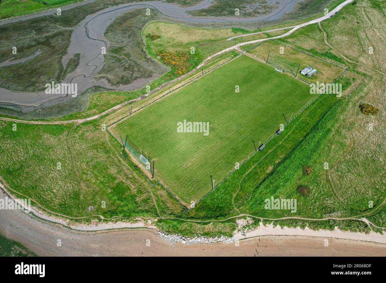 Aerial view of Pilmore Strand and the St Itas GAA pitch near Youghal in ...