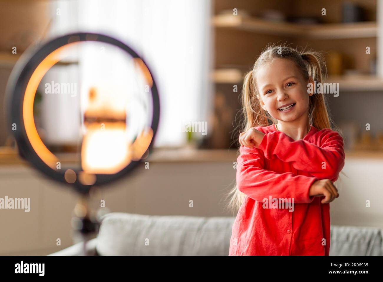 Cute Little Girl Kid Blogger Dancing At Camera At Home Stock Photo - Alamy
