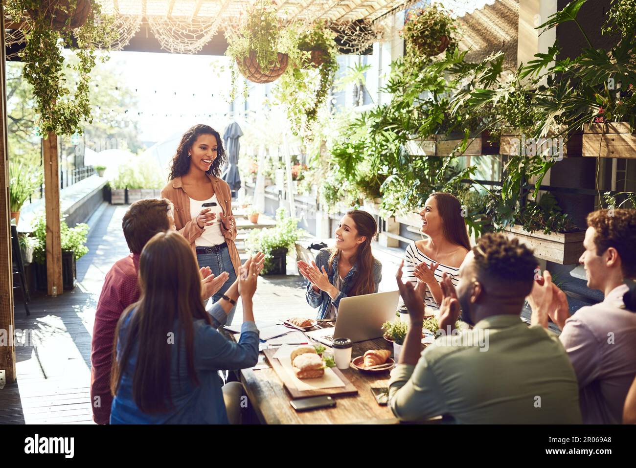 Sharing her ideas over lunch. an attractive young woman addressing her ...