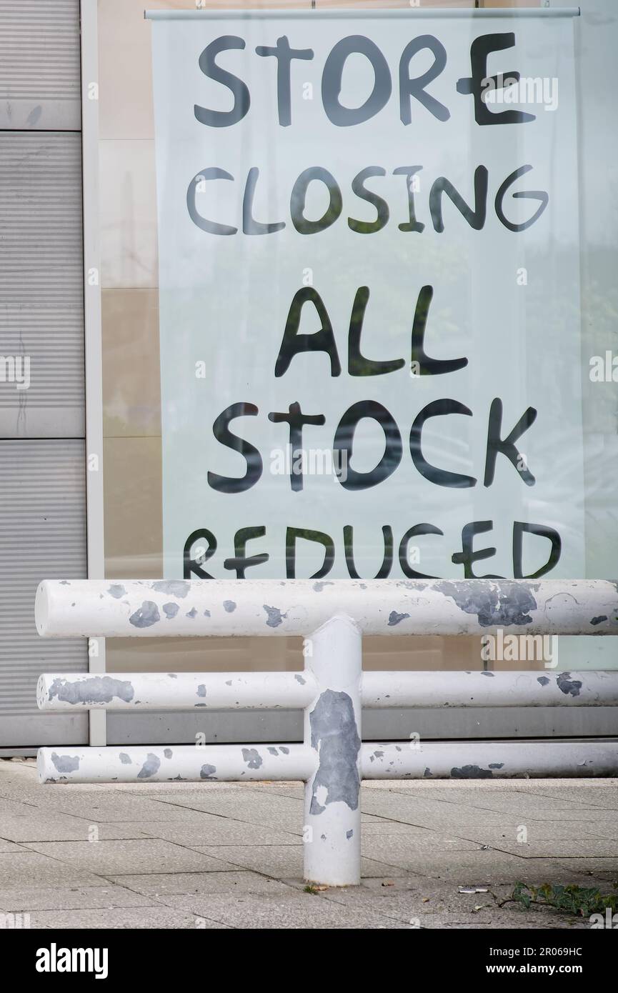 Store closing clearance sale now on sign in shop window Stock Photo - Alamy