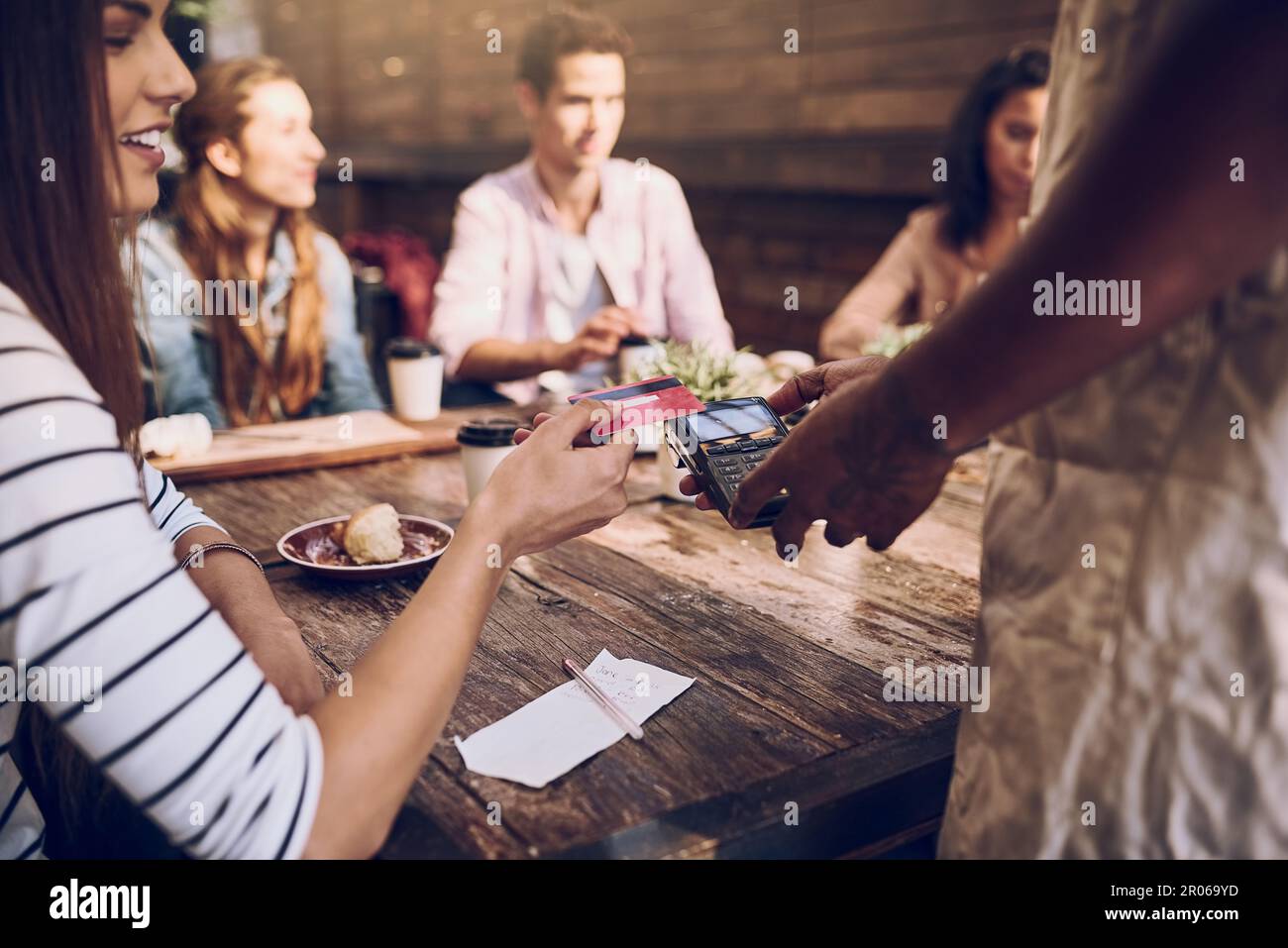 Ill just collect from them later. a woman ready to pay the bill at a ...