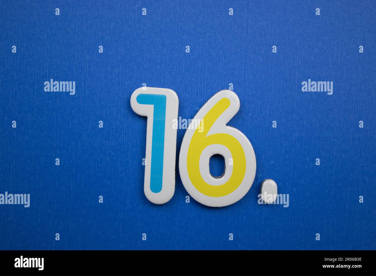 The number 16, light blue and yellow, placed on a blue background ...