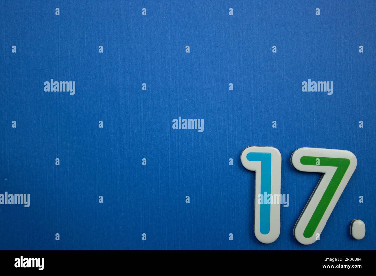 The number 17, light blue and green, photographed from above, placed on ...