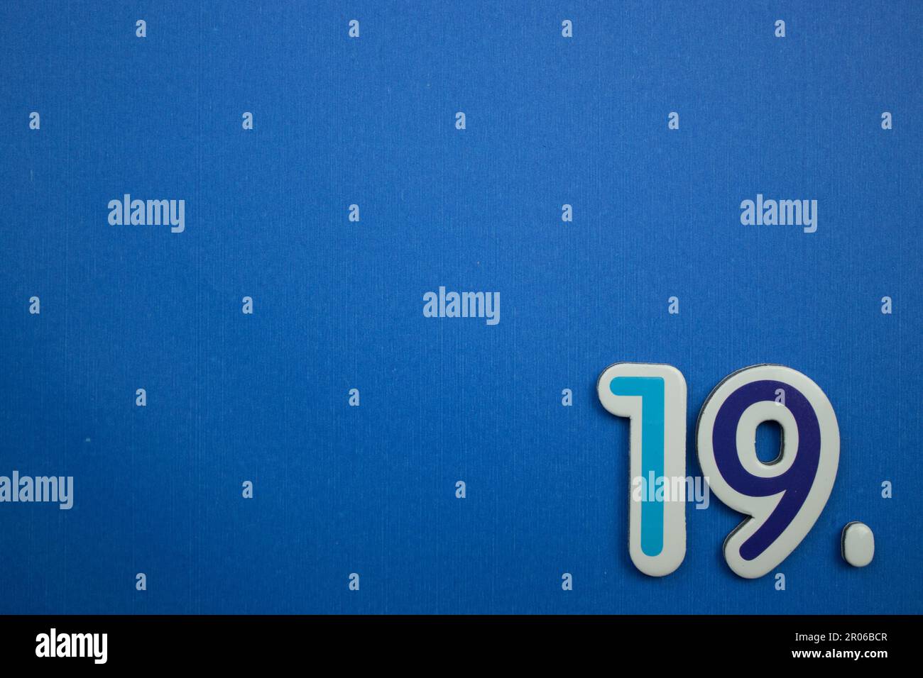 The number 19 in light blue and dark colors, photographed from above ...